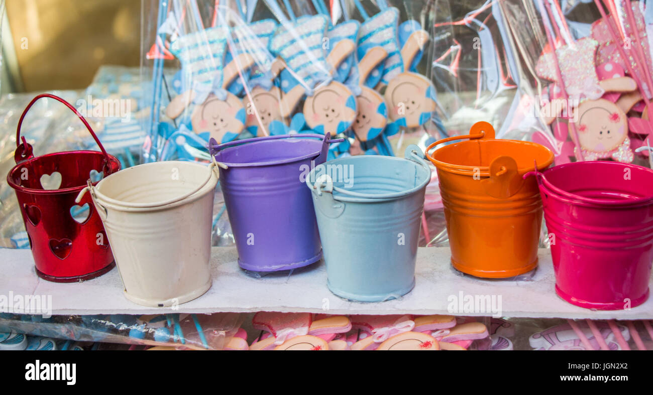 Little set of buckets of various colors in a market place Stock Photo ...