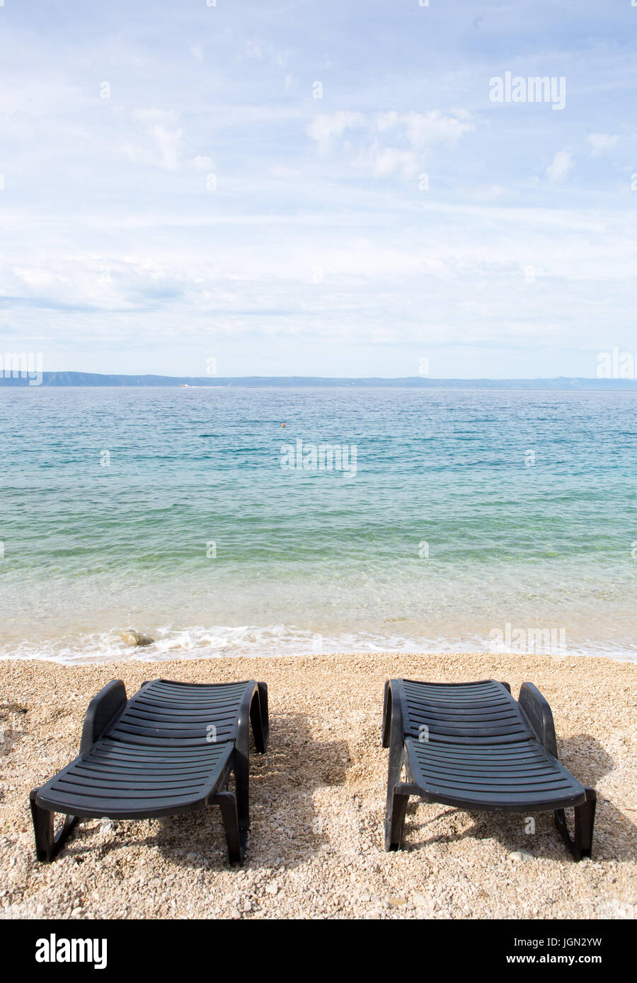 Comfortable black sunbed on the beach.Great place for sunbathing ...