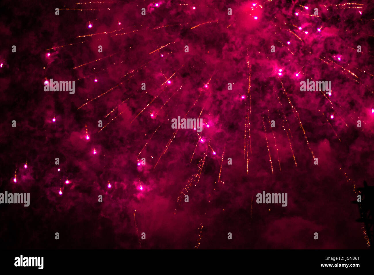 Multi-colored fireworks in the night sky Stock Photo - Alamy