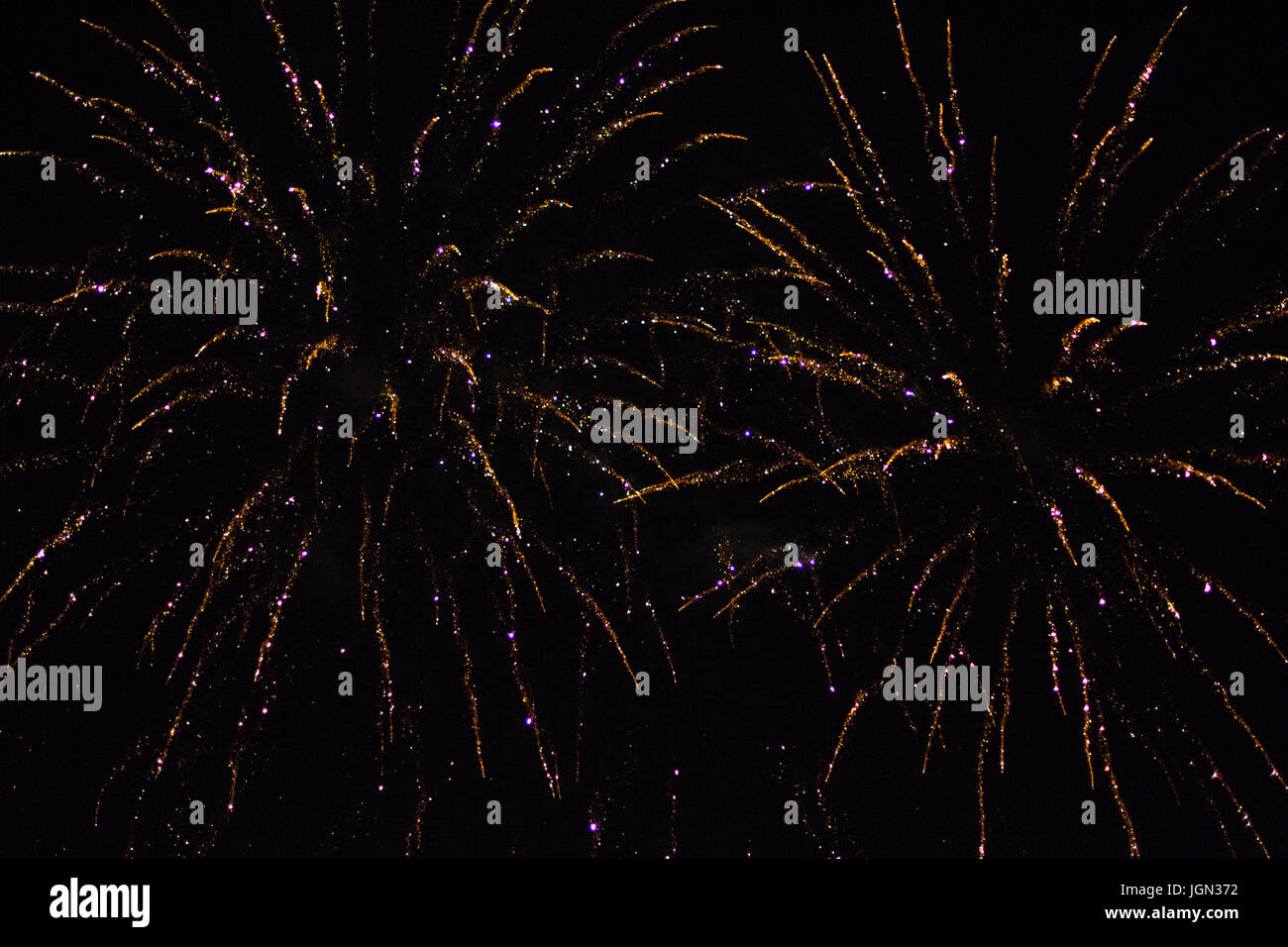 Multi-colored fireworks in the night sky Stock Photo - Alamy
