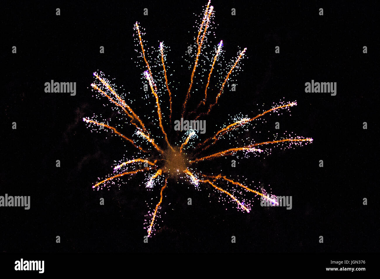 Multi-colored fireworks in the night sky Stock Photo - Alamy