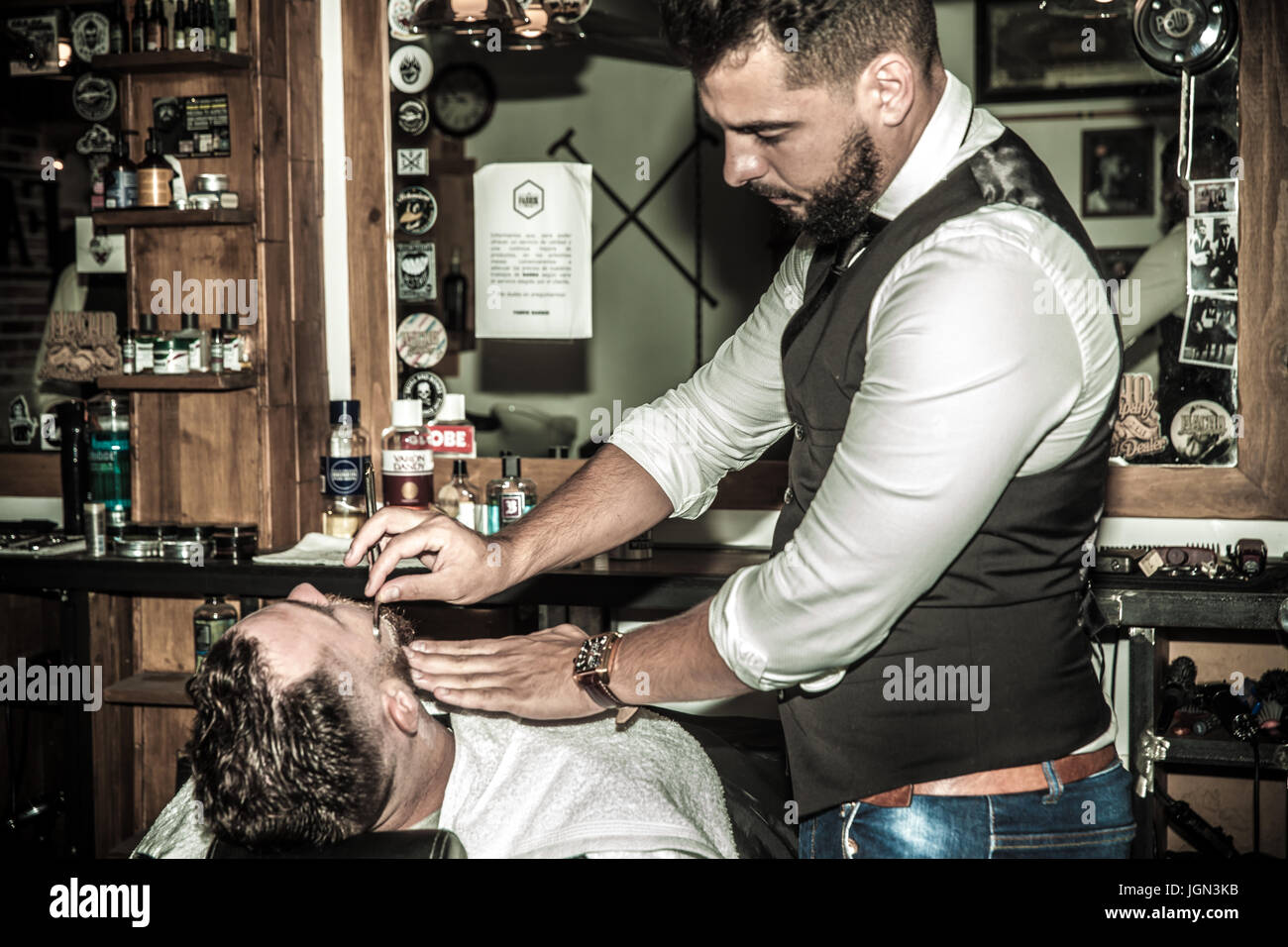 Barber cutting hair spain hi-res stock photography and images - Alamy