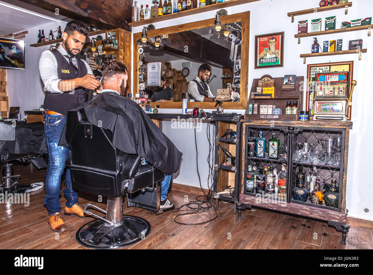 Barber cutting hair spain hi-res stock photography and images - Alamy
