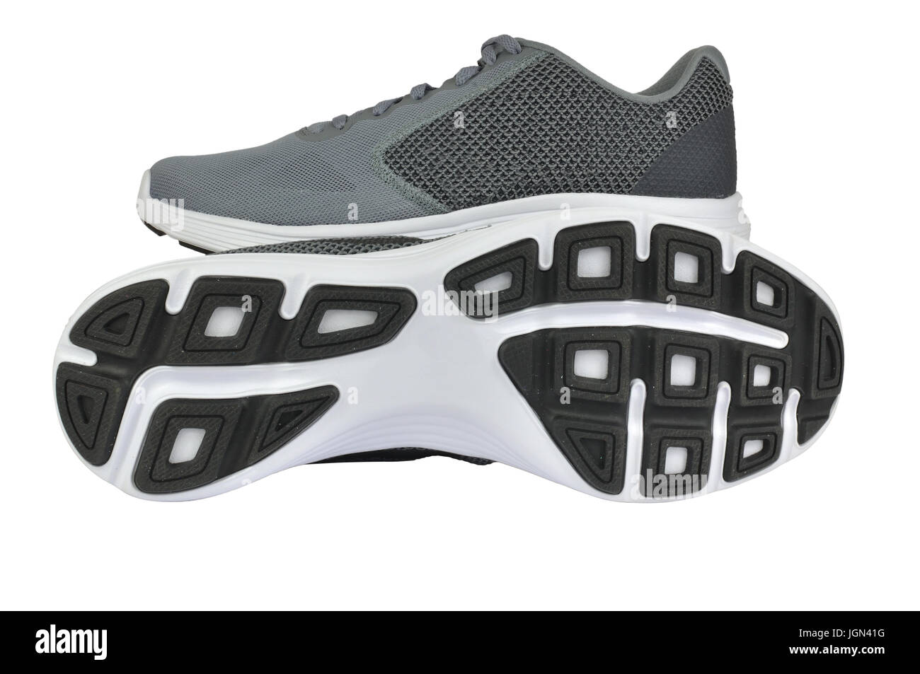 Gray sneakers, sole and side view on white background Stock Photo - Alamy