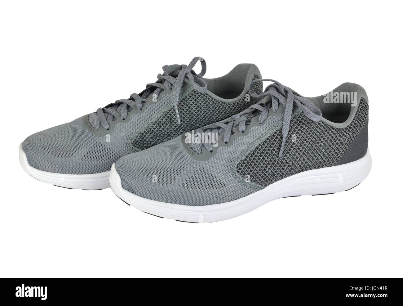 Side view of two gray sneakers, one behind the other, isolated on white ...