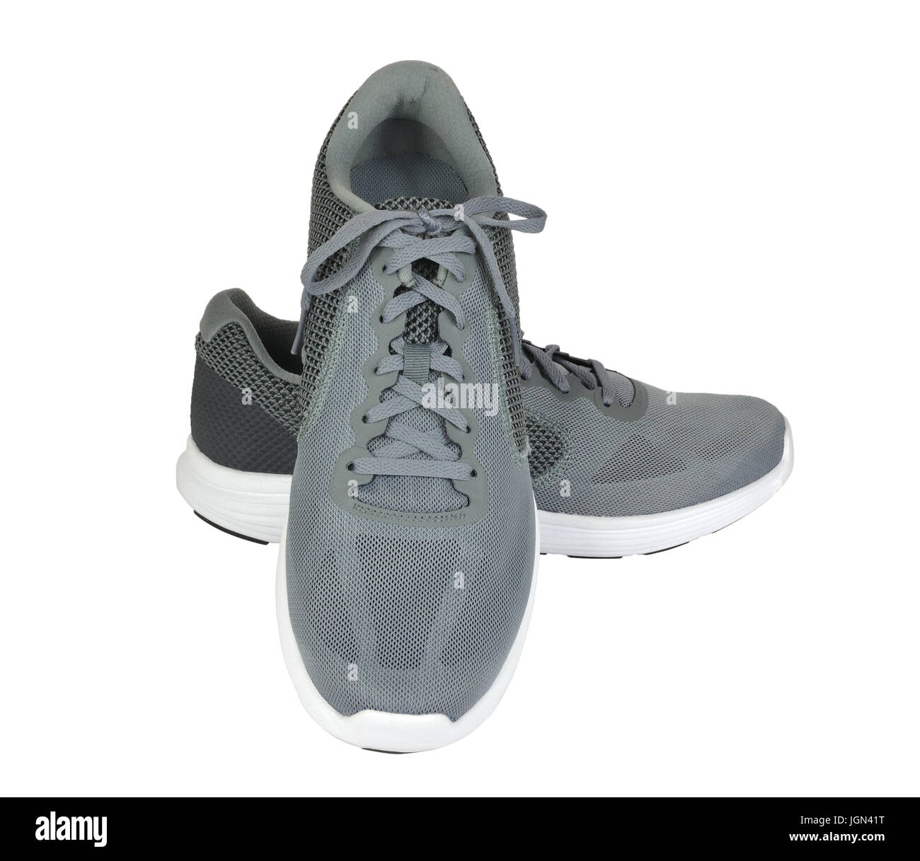 Two gray sneakers, one behind the other, isolated on white background ...