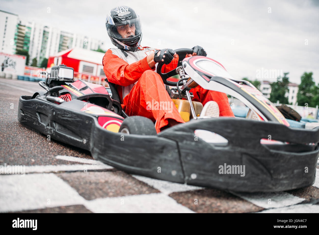 Kart racer on start line, go cart driver. Carting speed track, motor ...