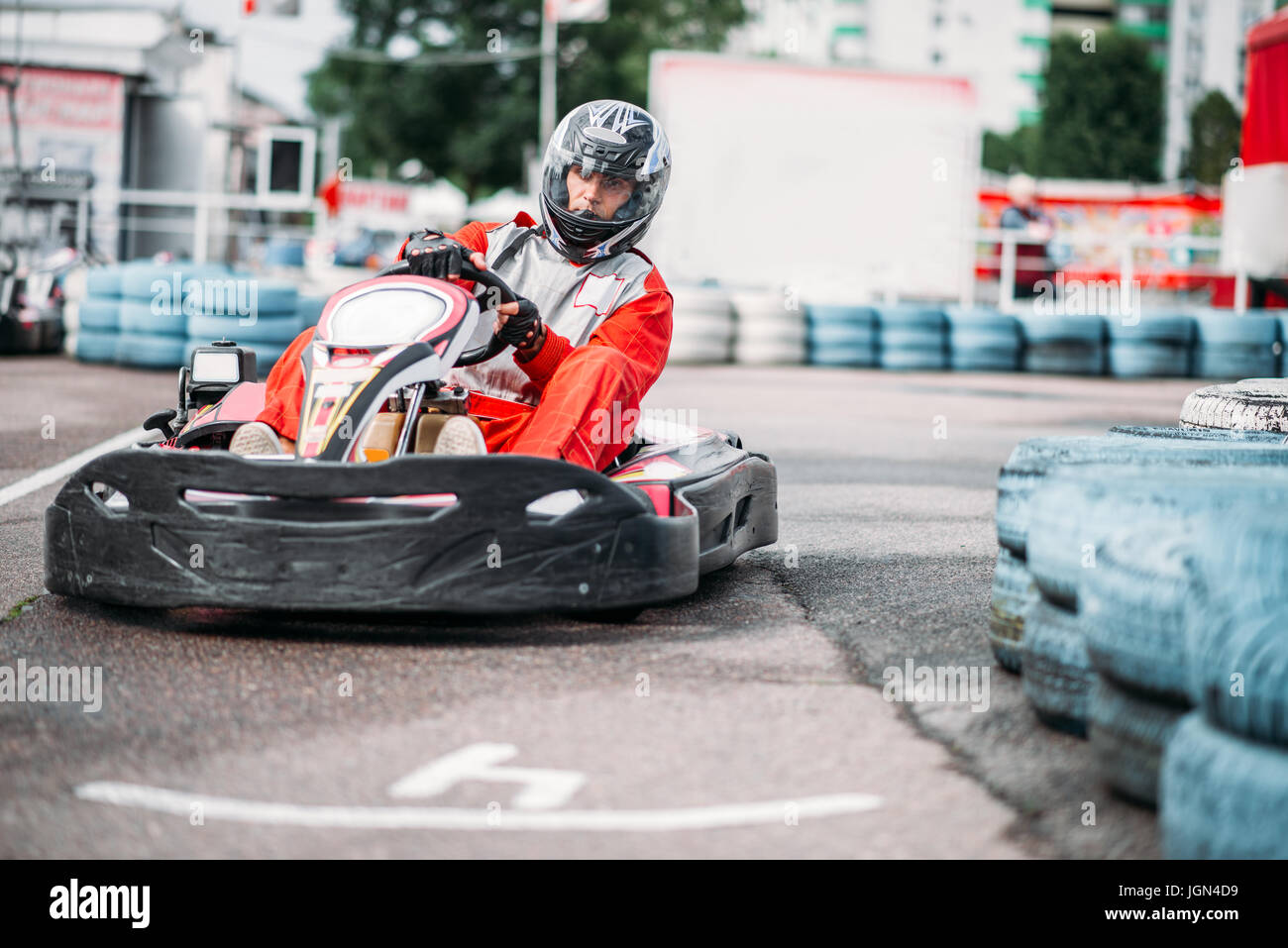 Karting racer in action, go kart competition on outdoor track. Carting ...