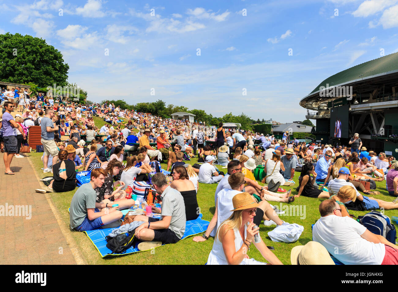 A crowded Aorangi Terrace, known as "Henman Hill" in hot weather and ...