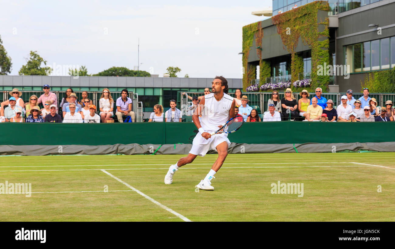 German tennis player Dustin Brown during a match at the Wimbledon ...
