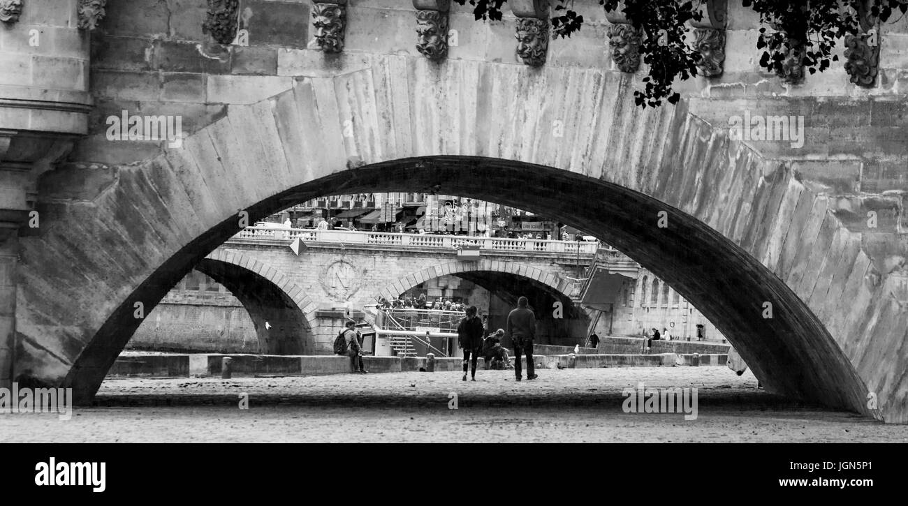 PARIS, FRANCE – 21 SEPTEMBER 2012: Arched bridges over the canals of ...