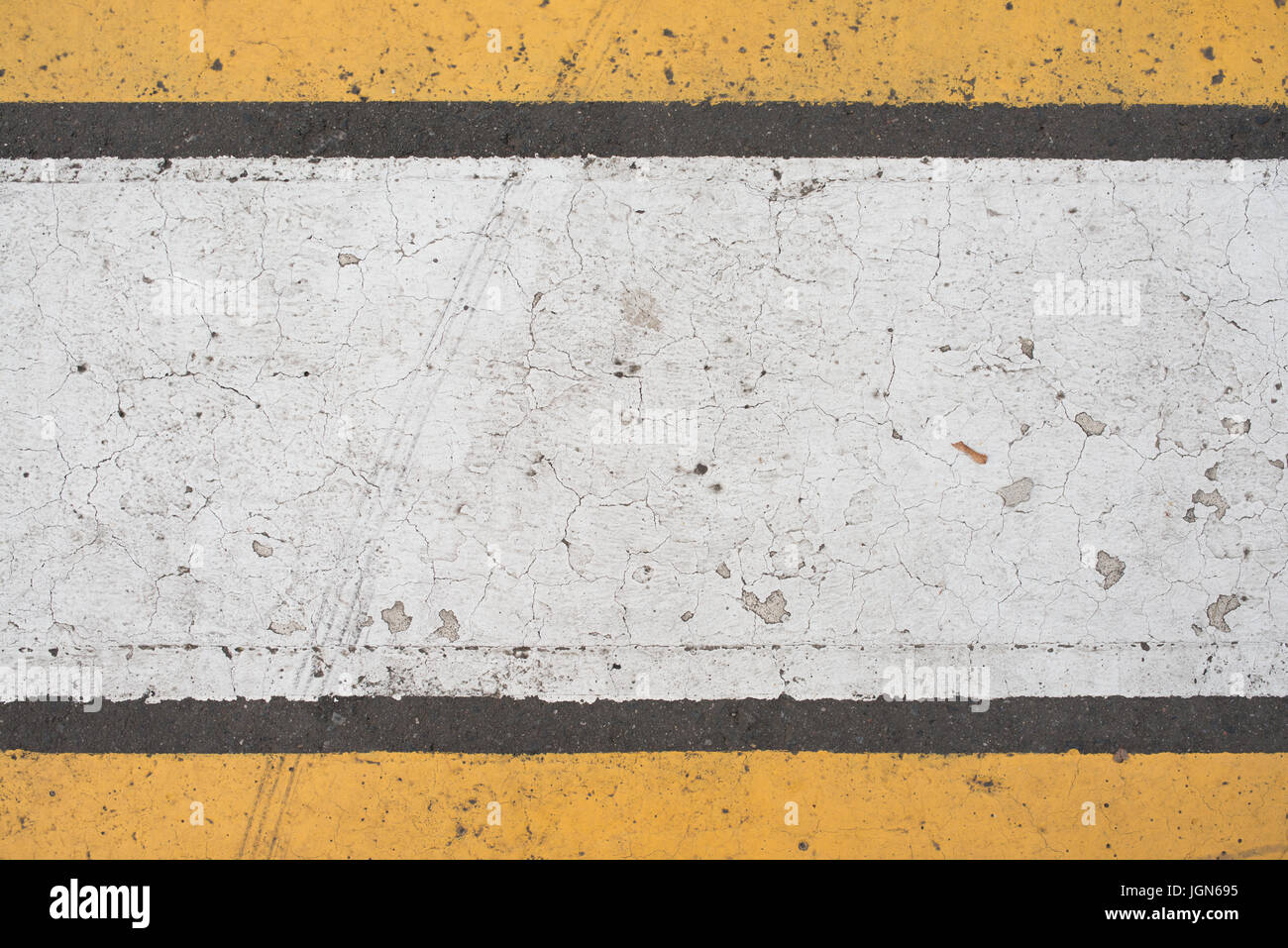 Asphalt highway texture with cracked white and yellow stripe Stock ...