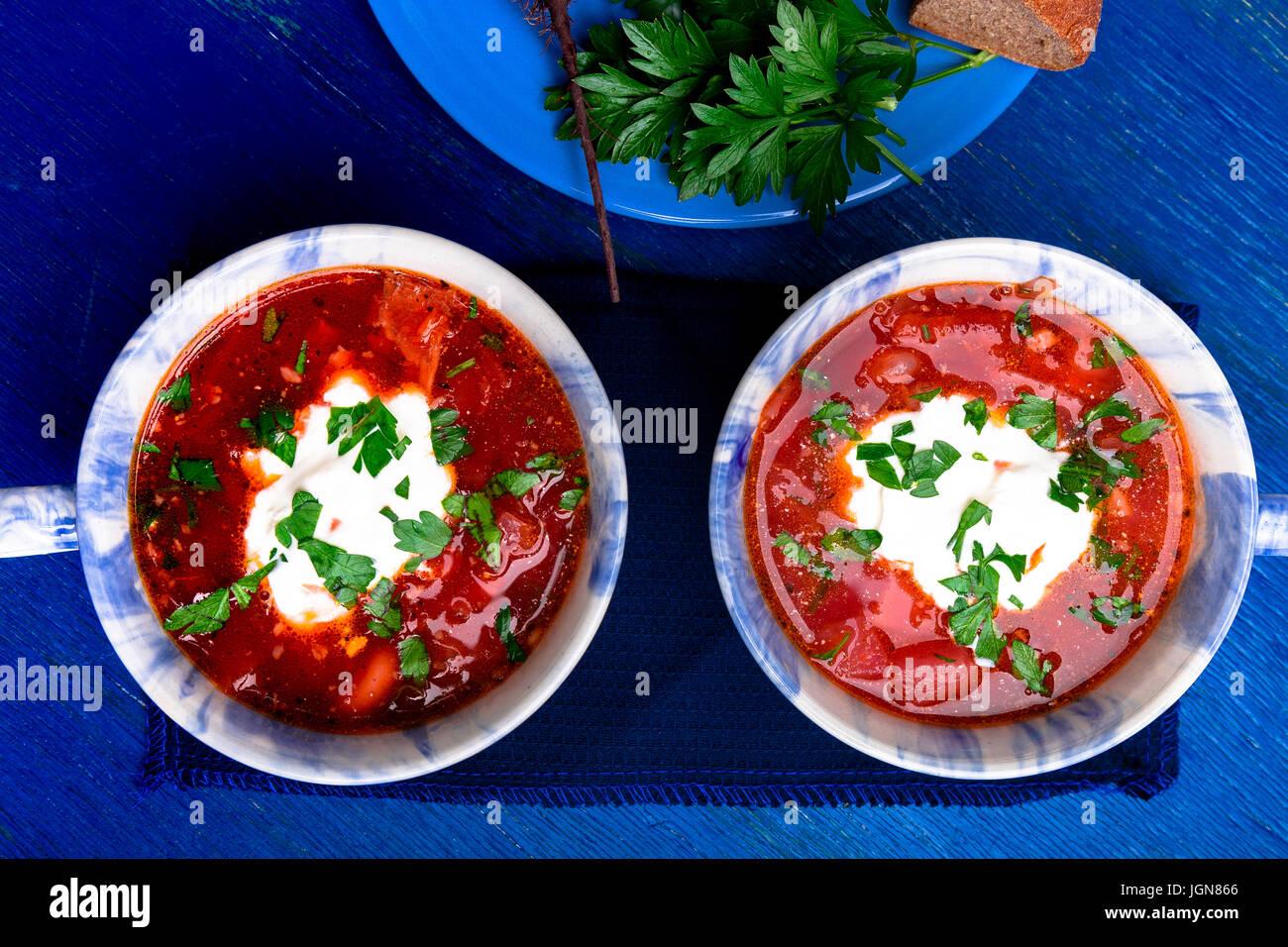 Ukrainian traditional borsch. Russian vegetarian red soup in blue bowl ...