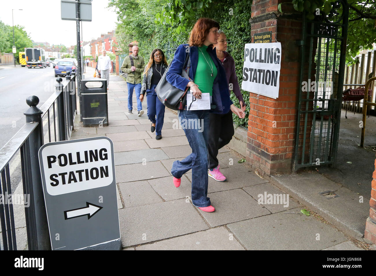 Voters arrive at a polling station in Chestnuts Primary School in ...