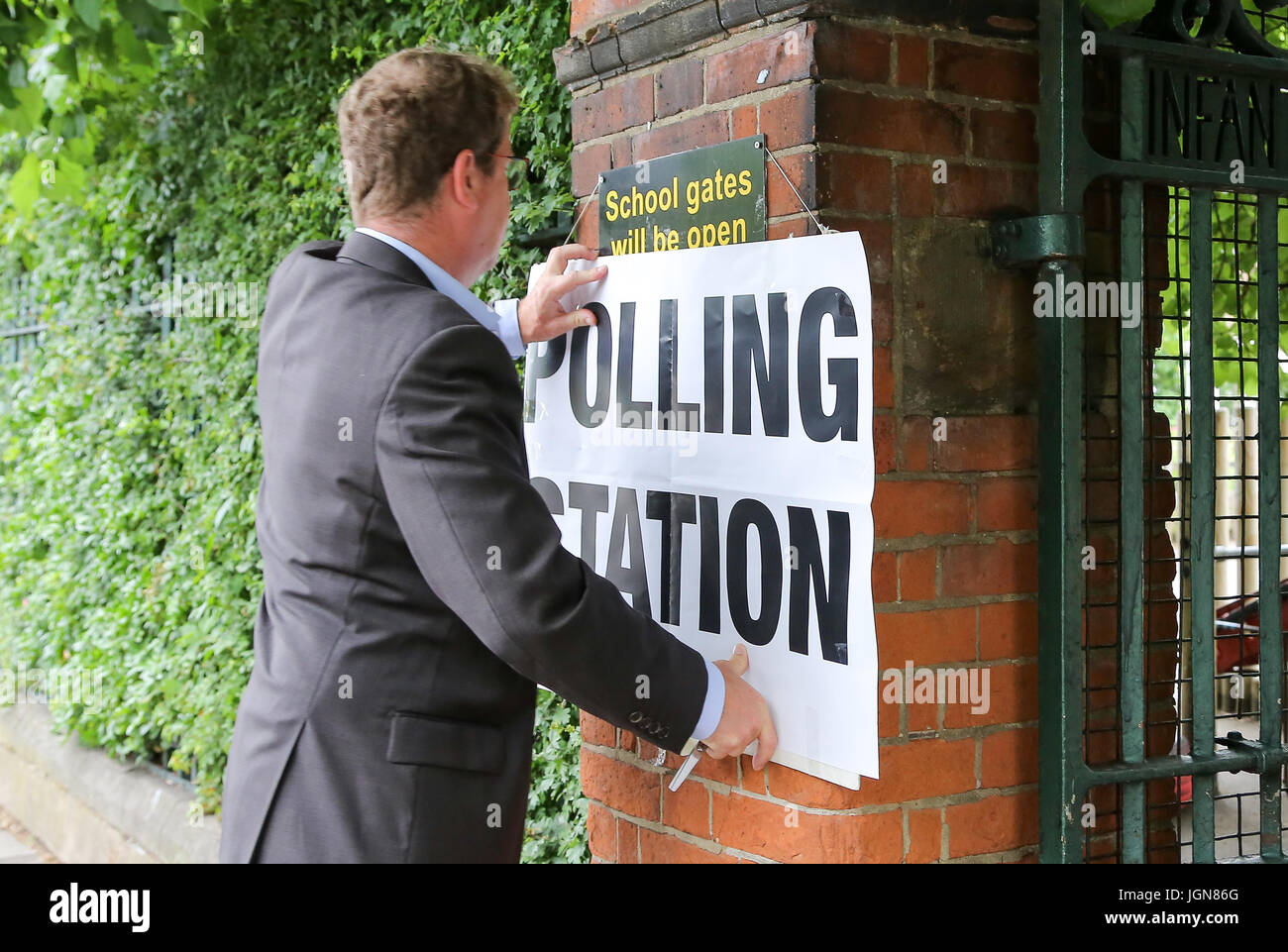 Voters arrive at a polling station in Chestnuts Primary School in ...