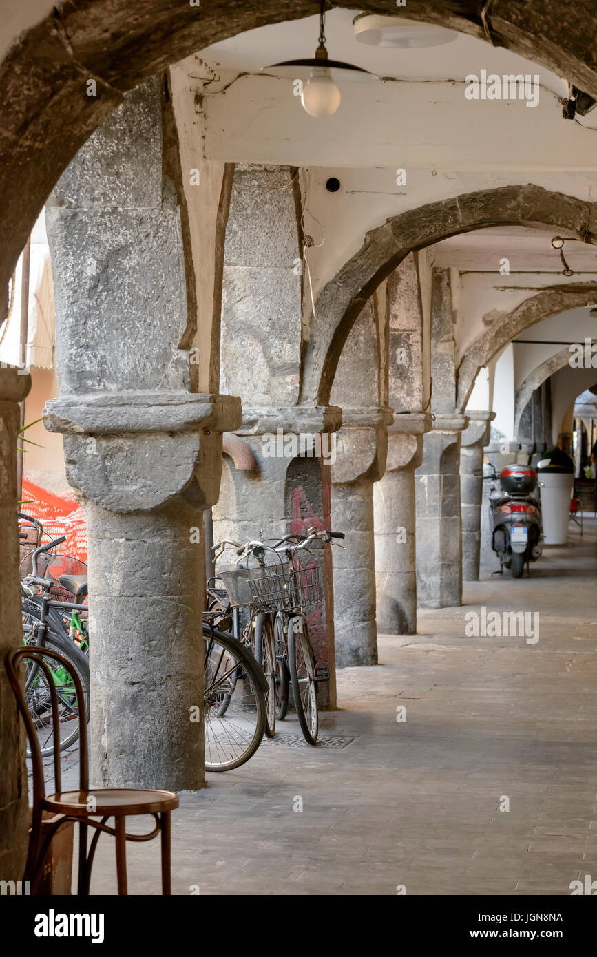 foreshortening of old medieval arched arcade, shot at Mediterranean ...
