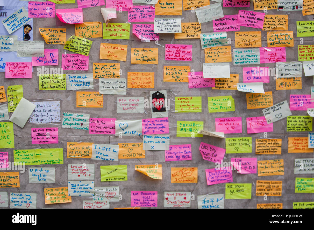 People reading and writing Post-it note tributes at London Bridge for ...