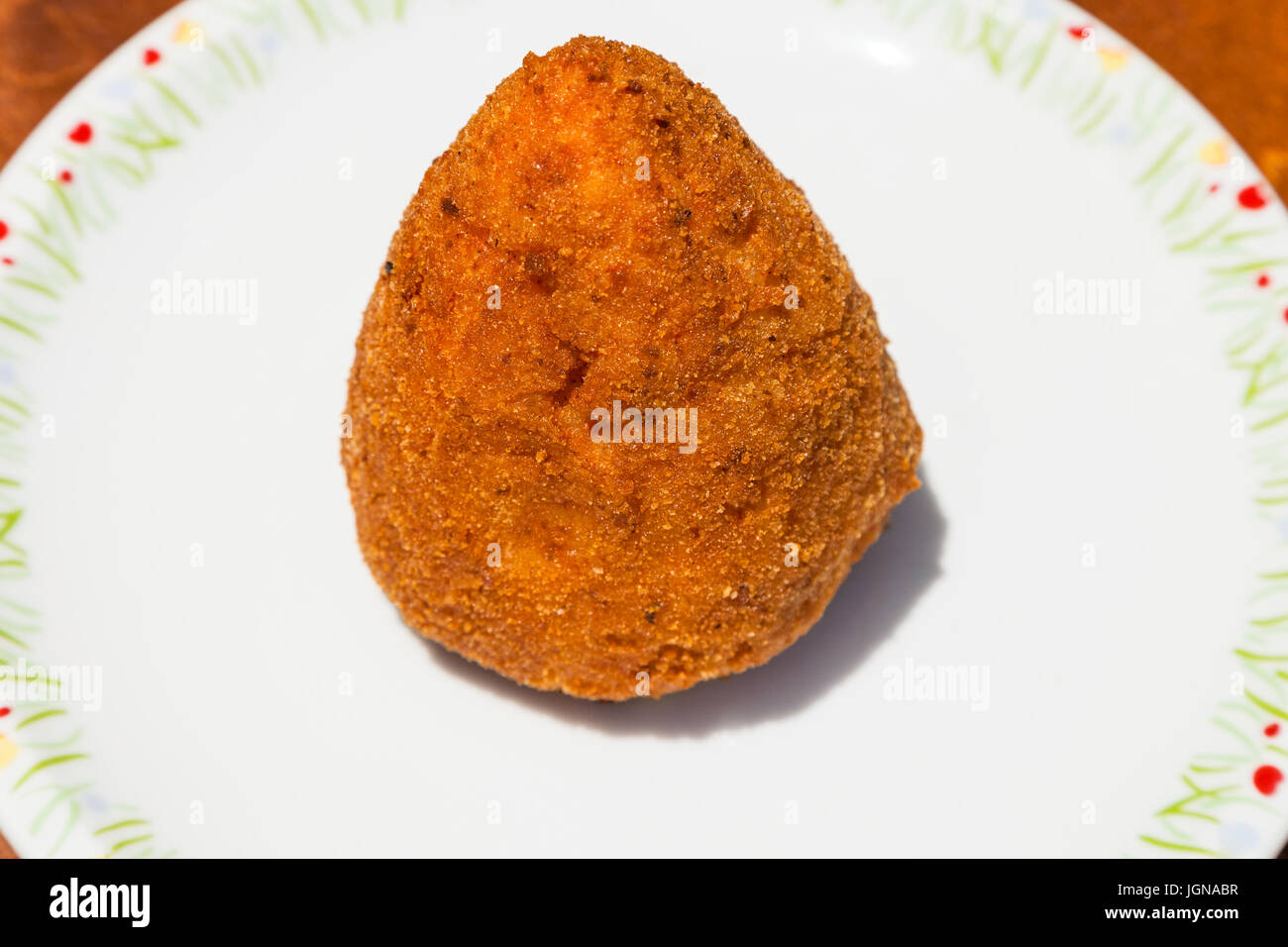 traditional sicilian street food - one meat stuffed rice ball arancini ...