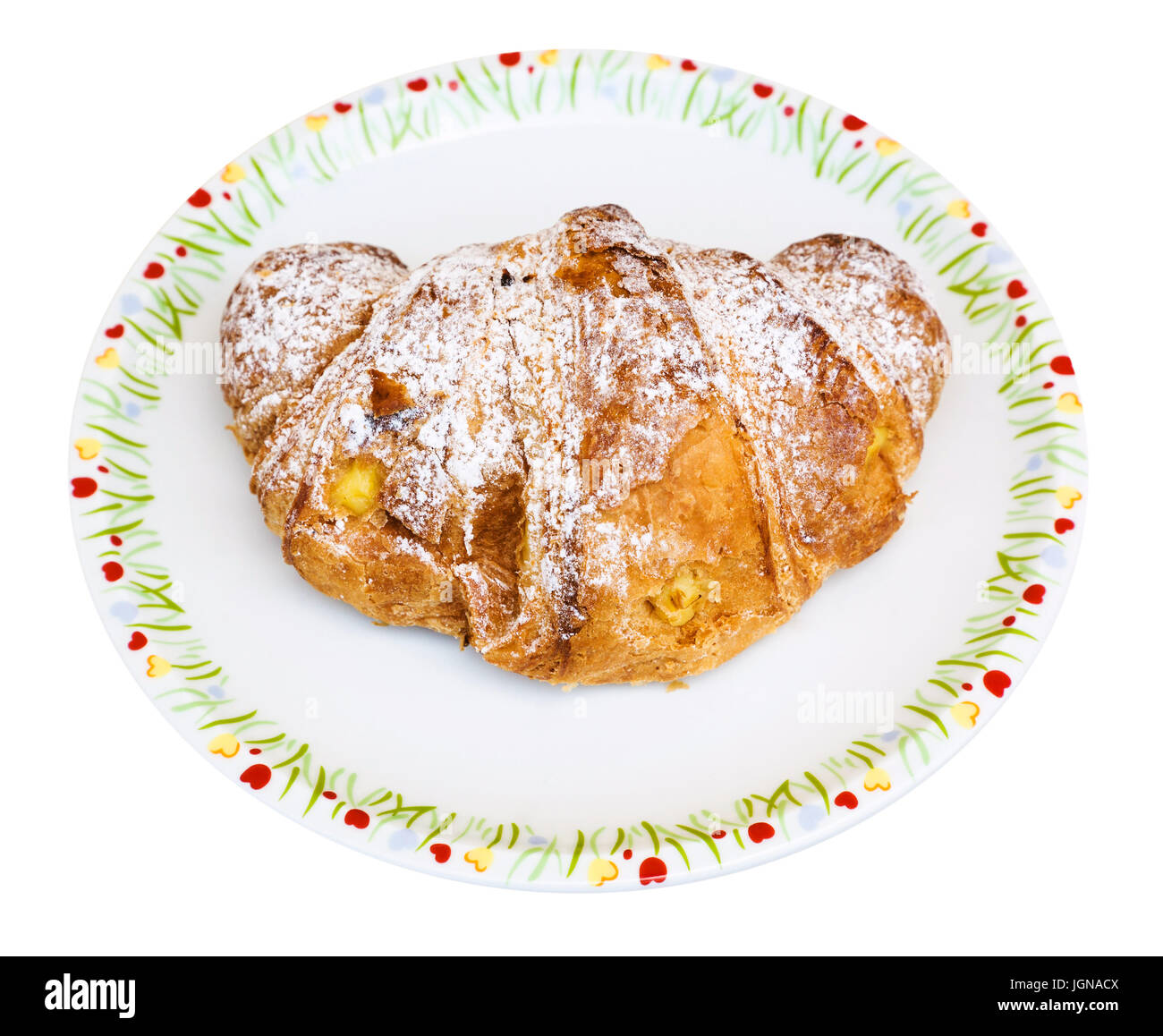 fresh italian croissant filled by vanilla cream on plate isolated on ...