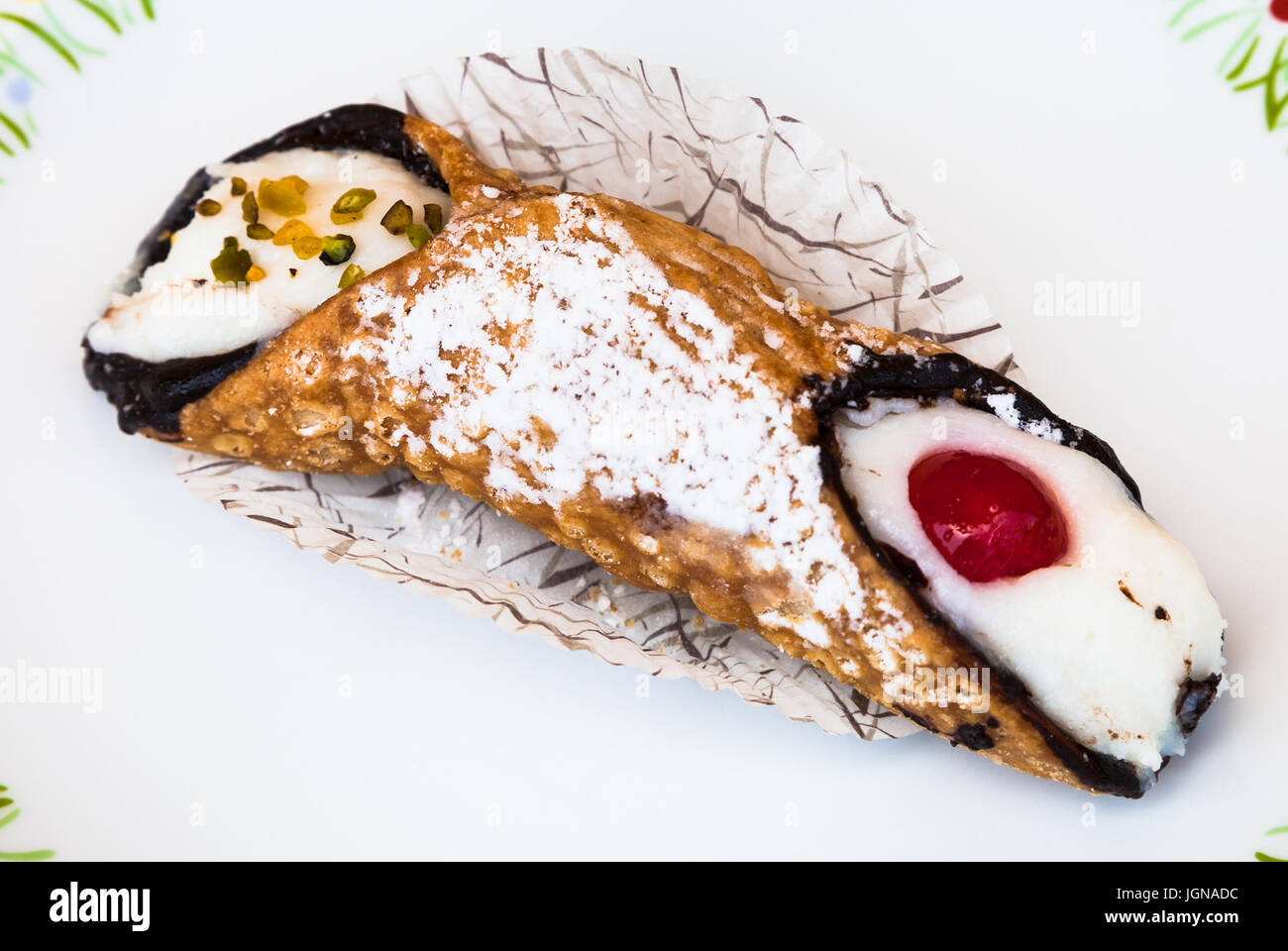 typical sicilian pastry Cannoli sprinkled with confectioner's sugar omn ...