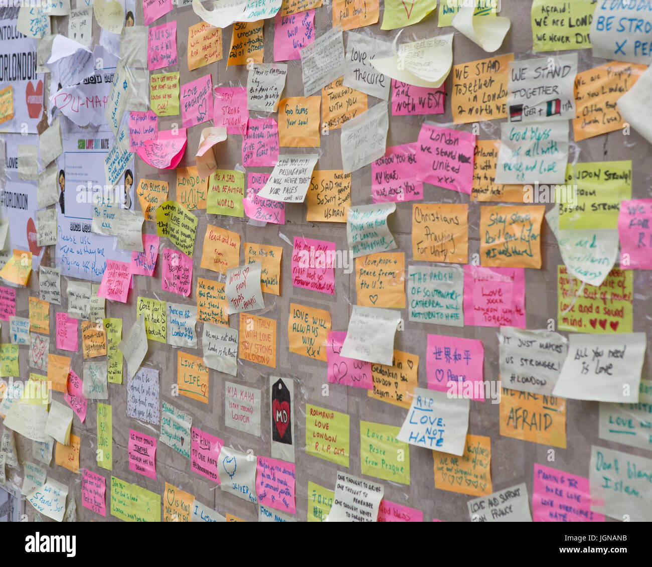People reading & writing post it note tributes at London Bridge for the ...