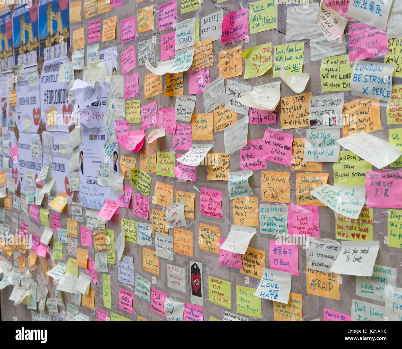 People reading & writing post it note tributes at London Bridge for the ...