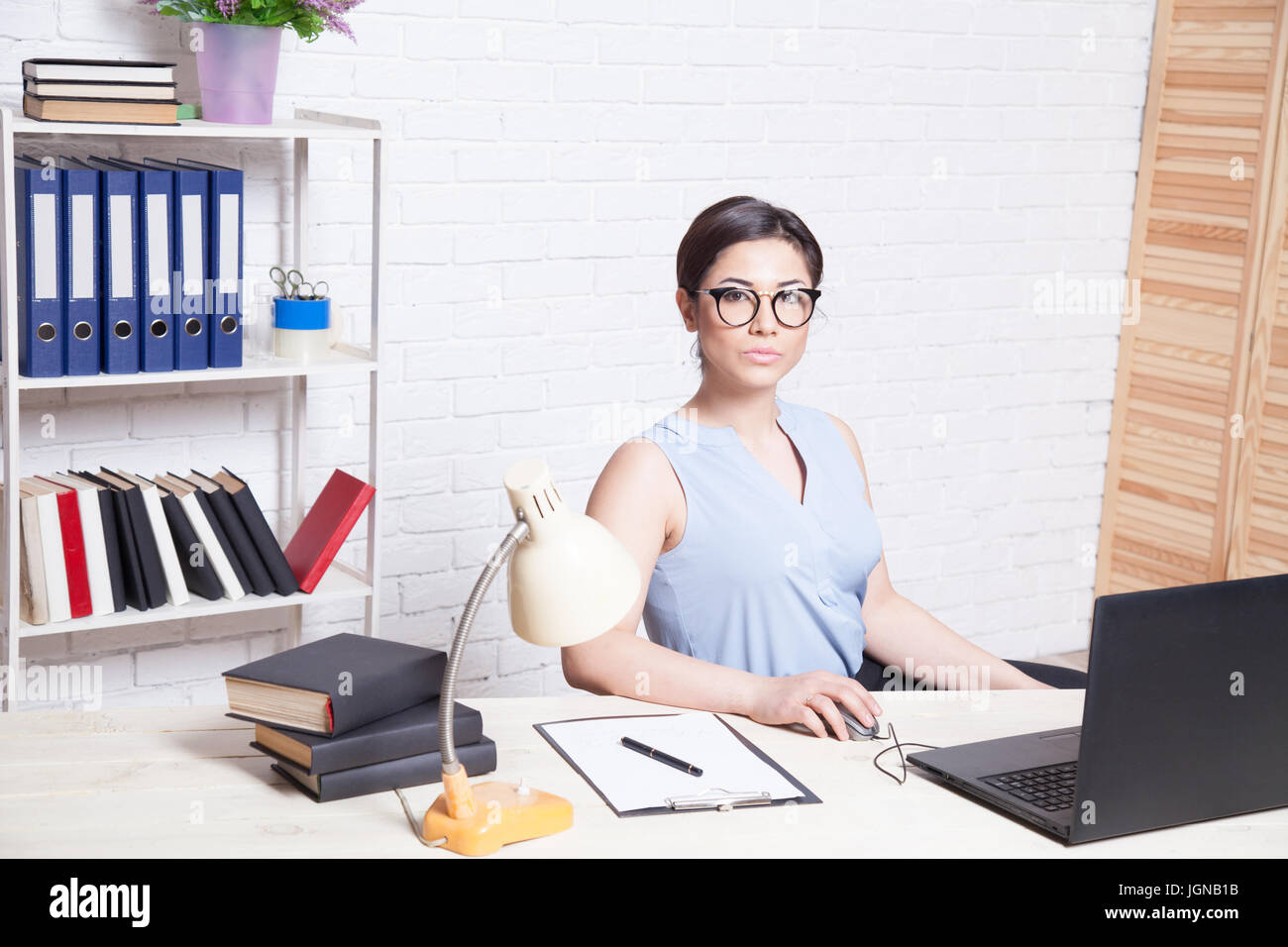 business girl sits in a white Office works at the computer Stock Photo ...