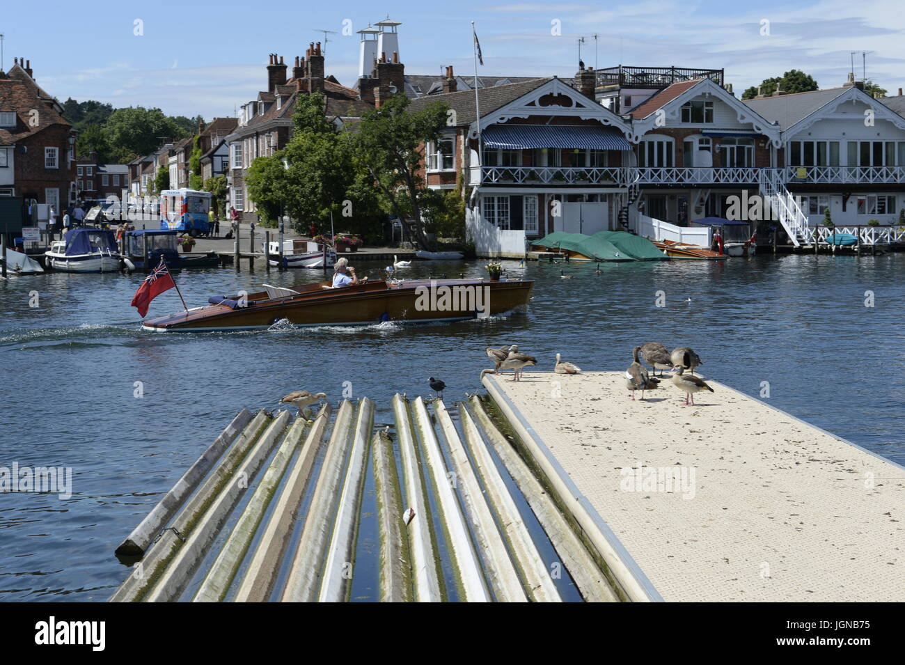 Old motor launch near a rowing pontoon, Henley regatta Stock Photo - Alamy