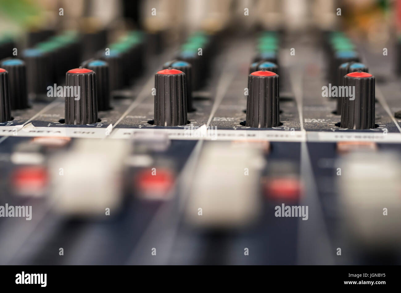 Close up shot of a professional audio mixing console with faders Stock Photo - Alamy