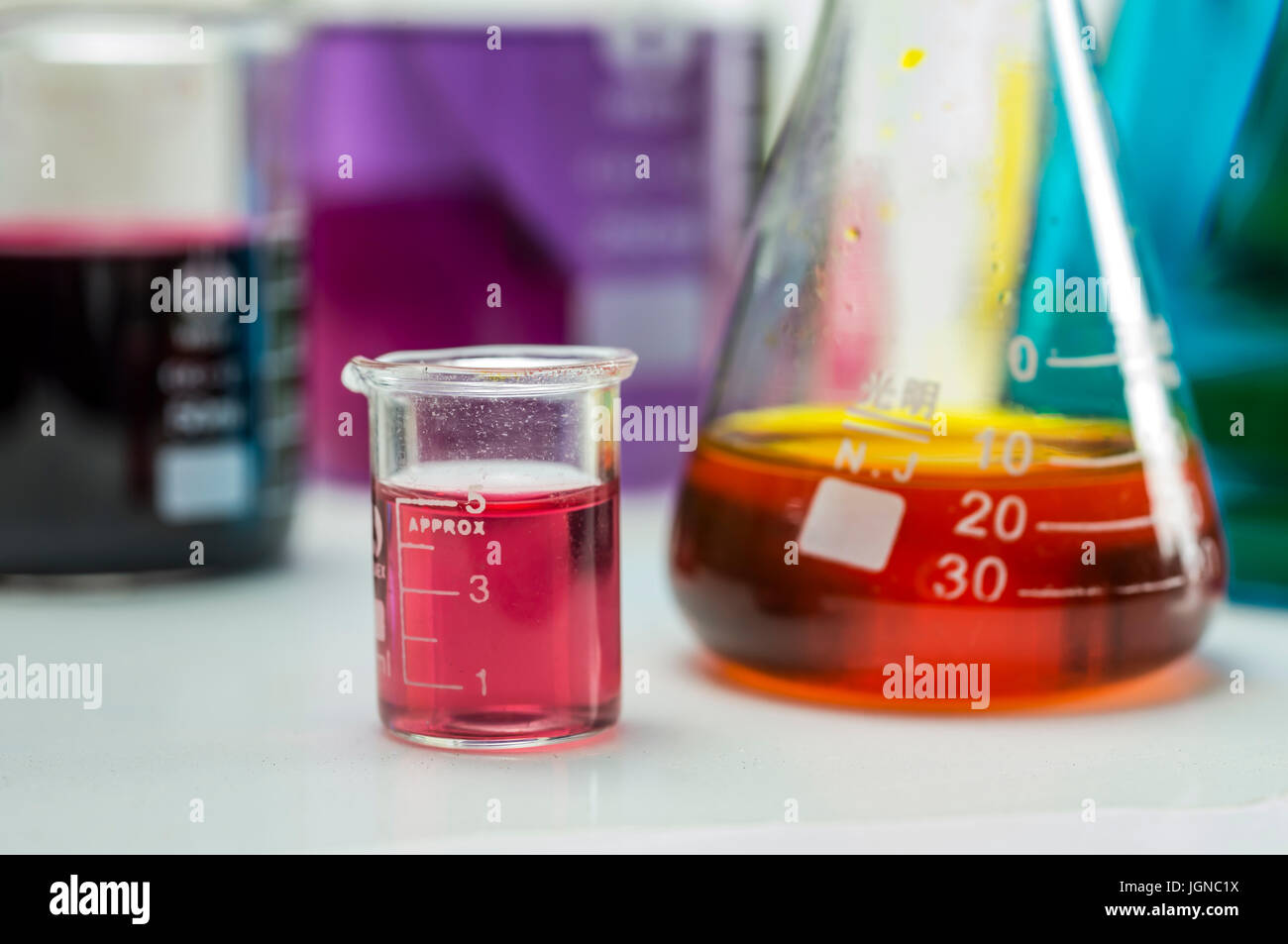 Close Up Shot Of Chemistry Lab Flasks With Different Chemicals Stock