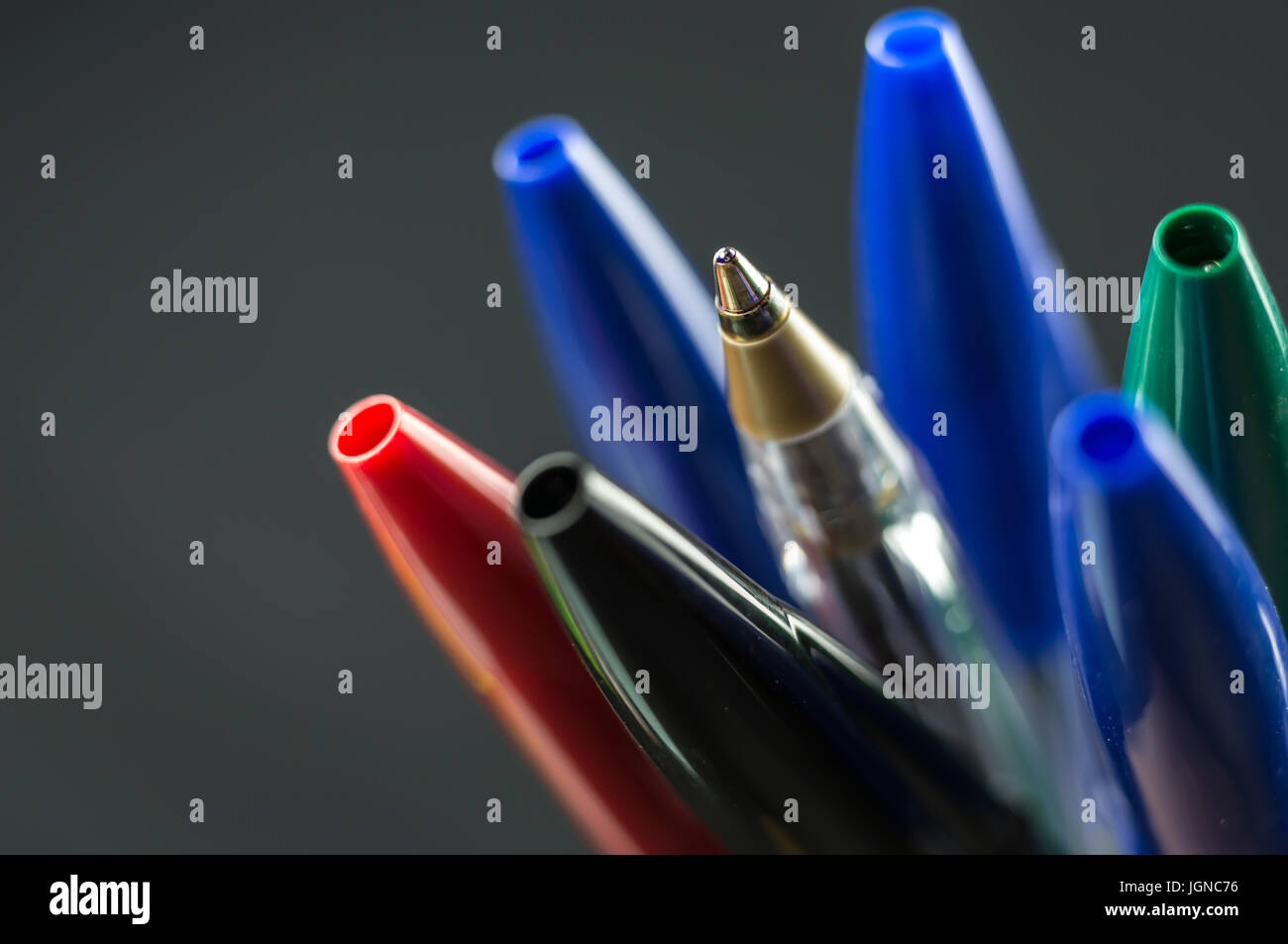 Macro shot of ballpoint pens in red green blue and black colors Stock ...