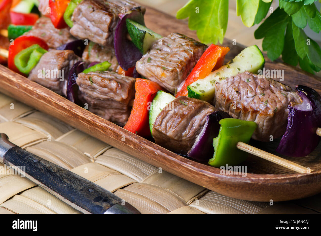 Brochettes of meat and vegetables, grilled on the barbecue Stock Photo ...