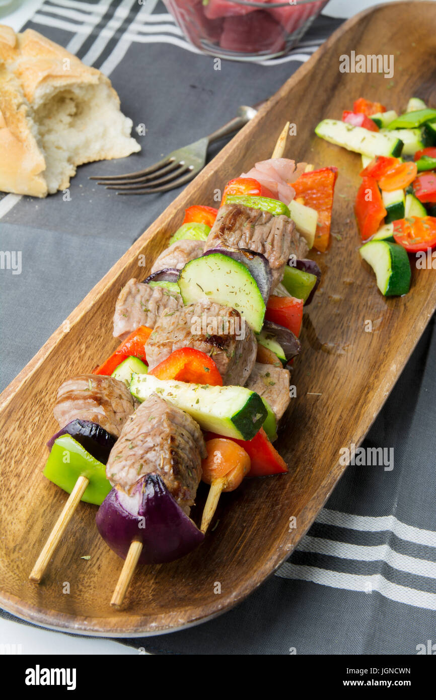 Brochettes of meat and vegetables, grilled on the barbecue Stock Photo ...