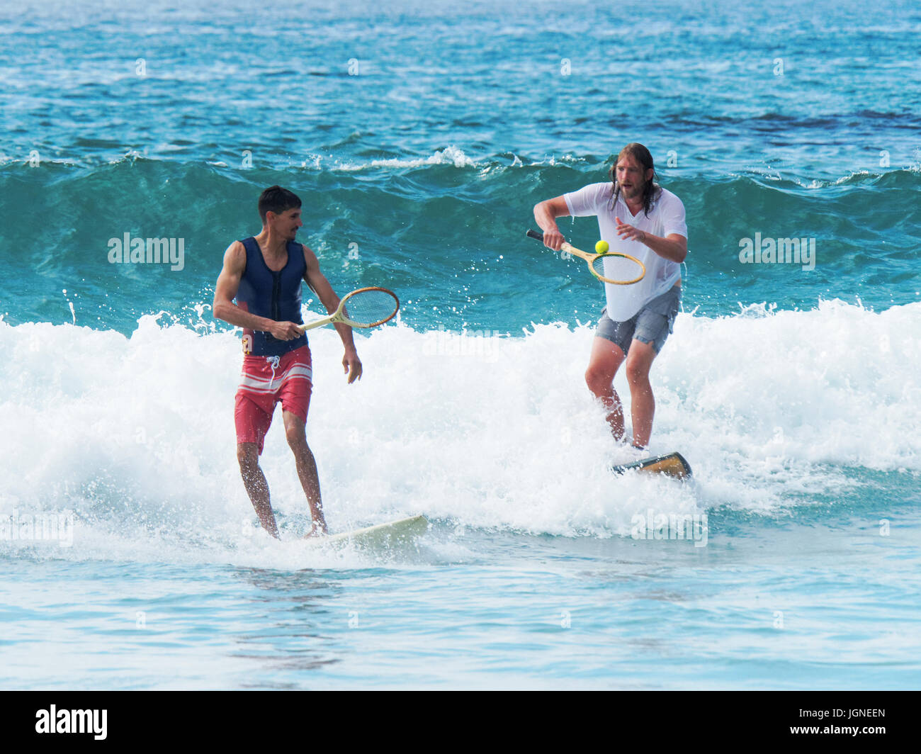 Surfing fun fancy dress surfers Stock Photo - Alamy