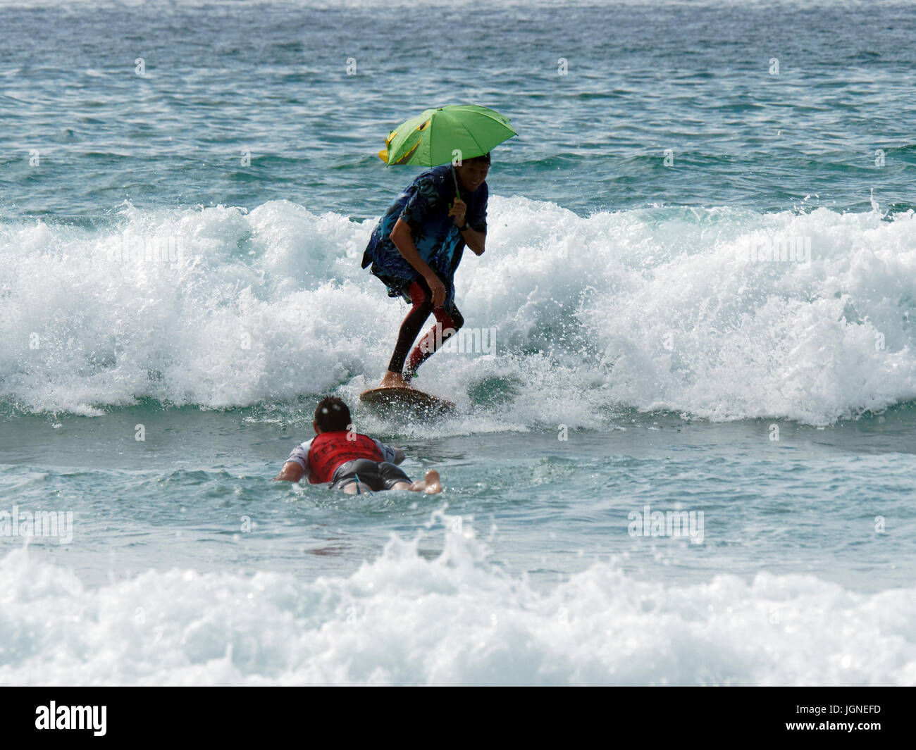 Surfing fun fancy dress surfers Stock Photo - Alamy