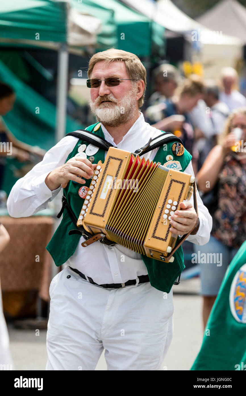 English morris dancer playing the concertina hi-res stock photography ...