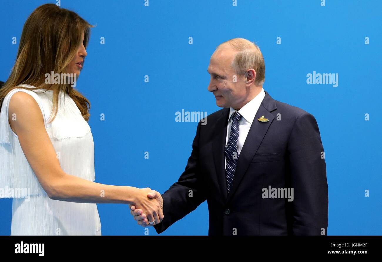 Russian President Vladimir Putin, right, shakes hands with U.S. First ...