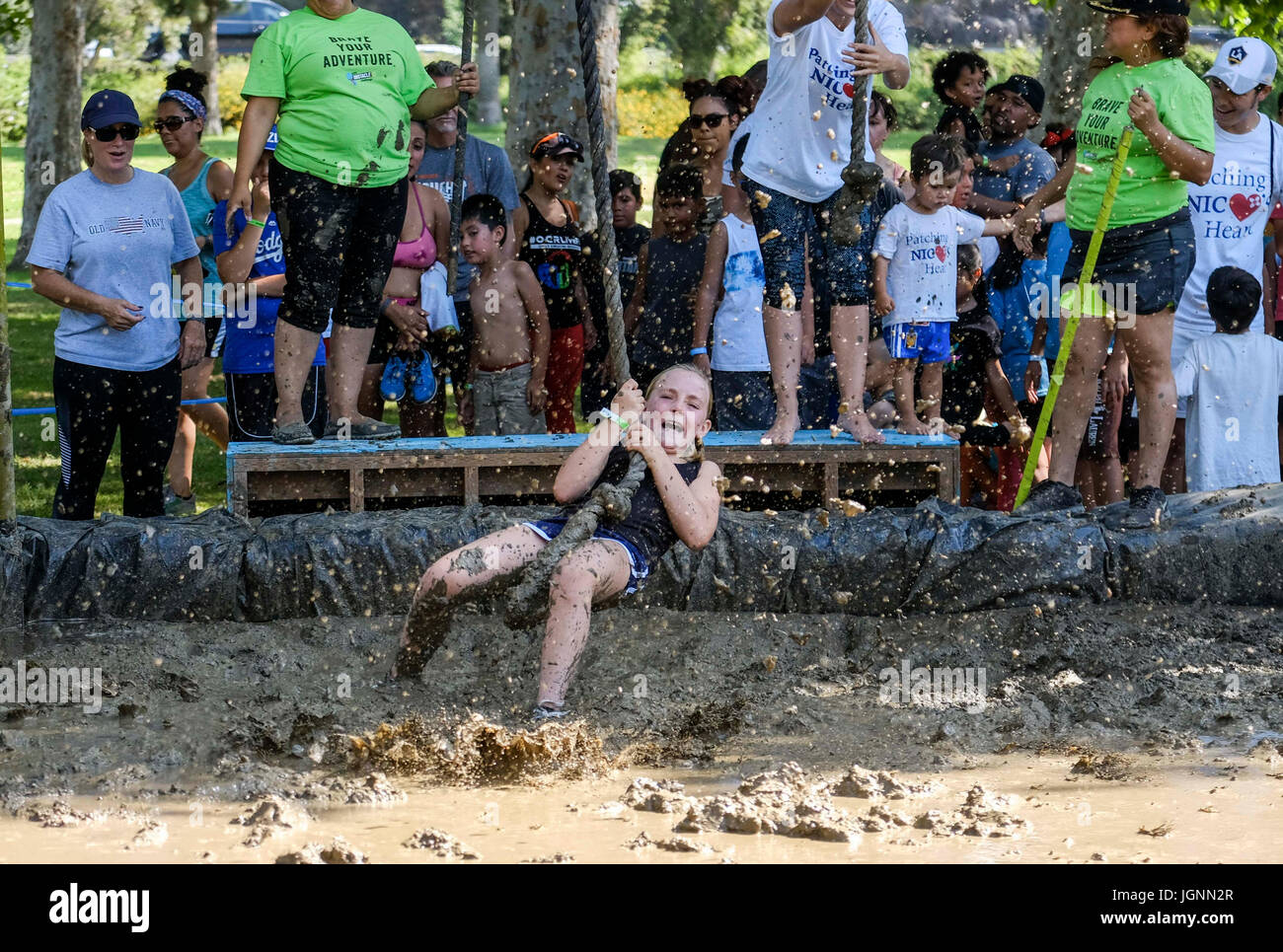 Los Angeles, USA. 8th July, 2017. A boy crosses the mud pit during the ...