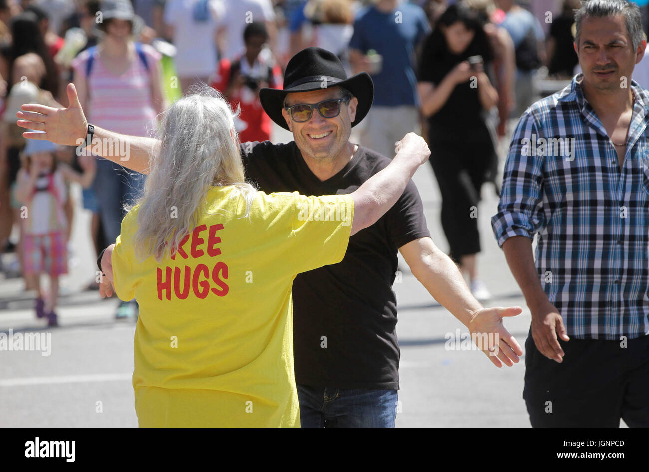 Vancouver, Canada. 8th July, 2017. People give a hug to each other ...