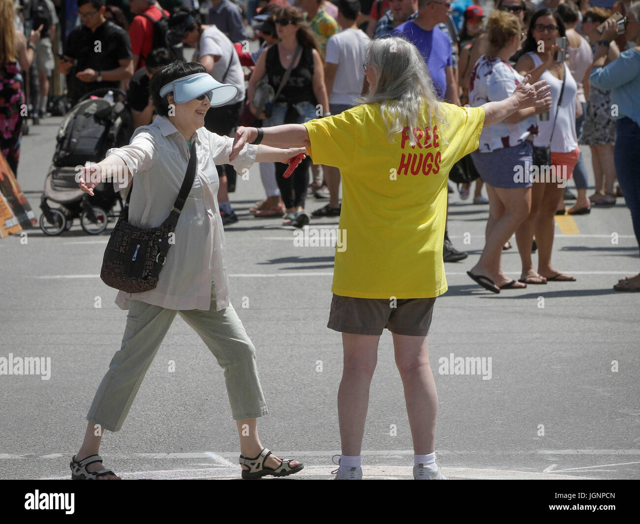 Vancouver, Canada. 8th July, 2017. People give a hug to each other ...