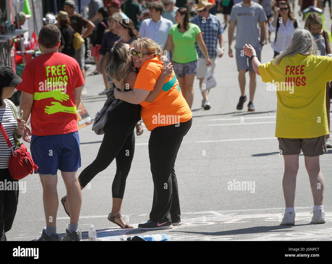 Vancouver, Canada. 8th July, 2017. People give a hug to each other ...
