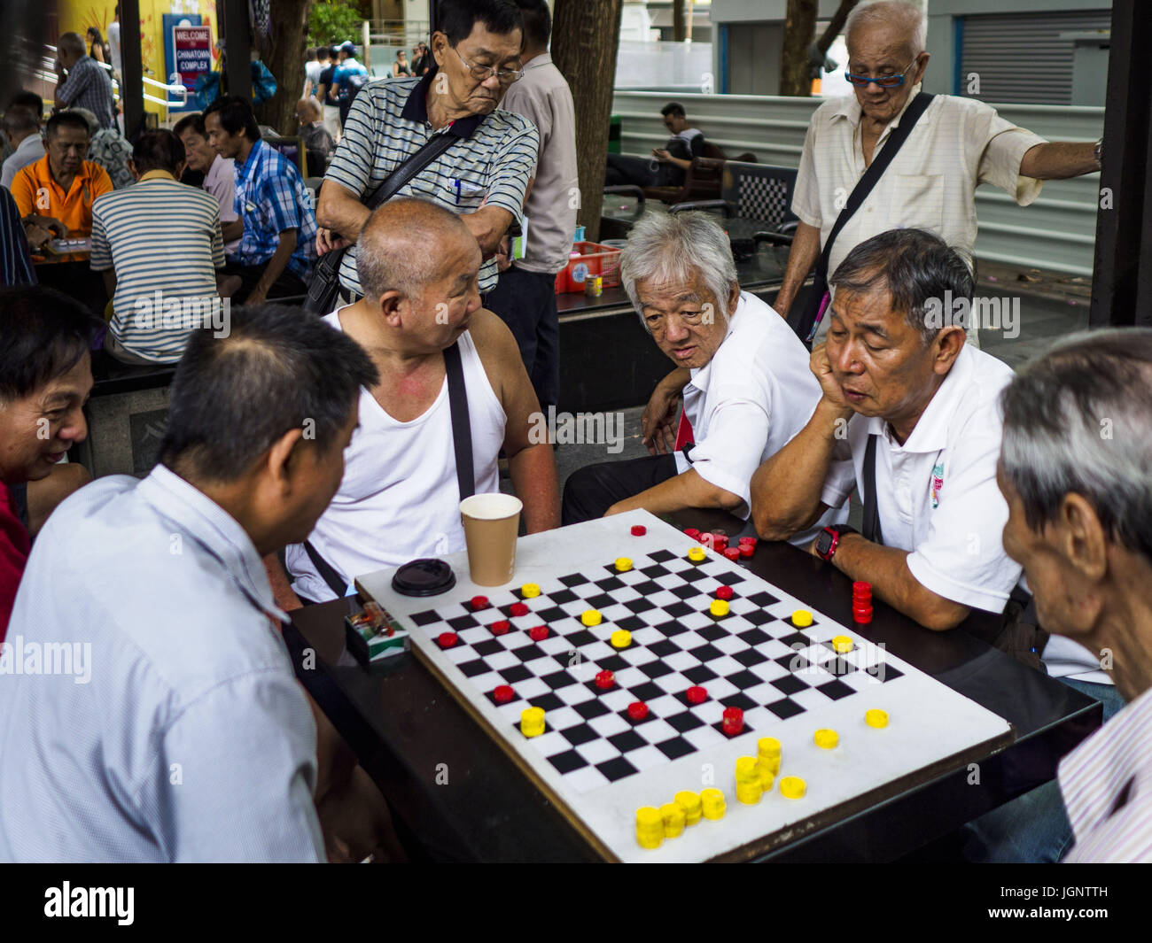 Singapore, Singapore. 9th July, 2017. Men play Chinese checkers in the ...