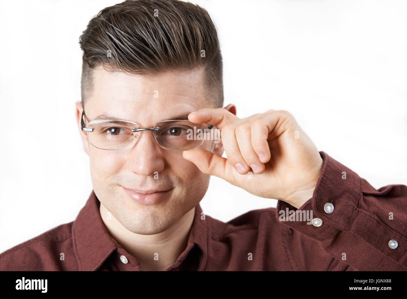 Young Man Trying On New Glasses Stock Photo - Alamy