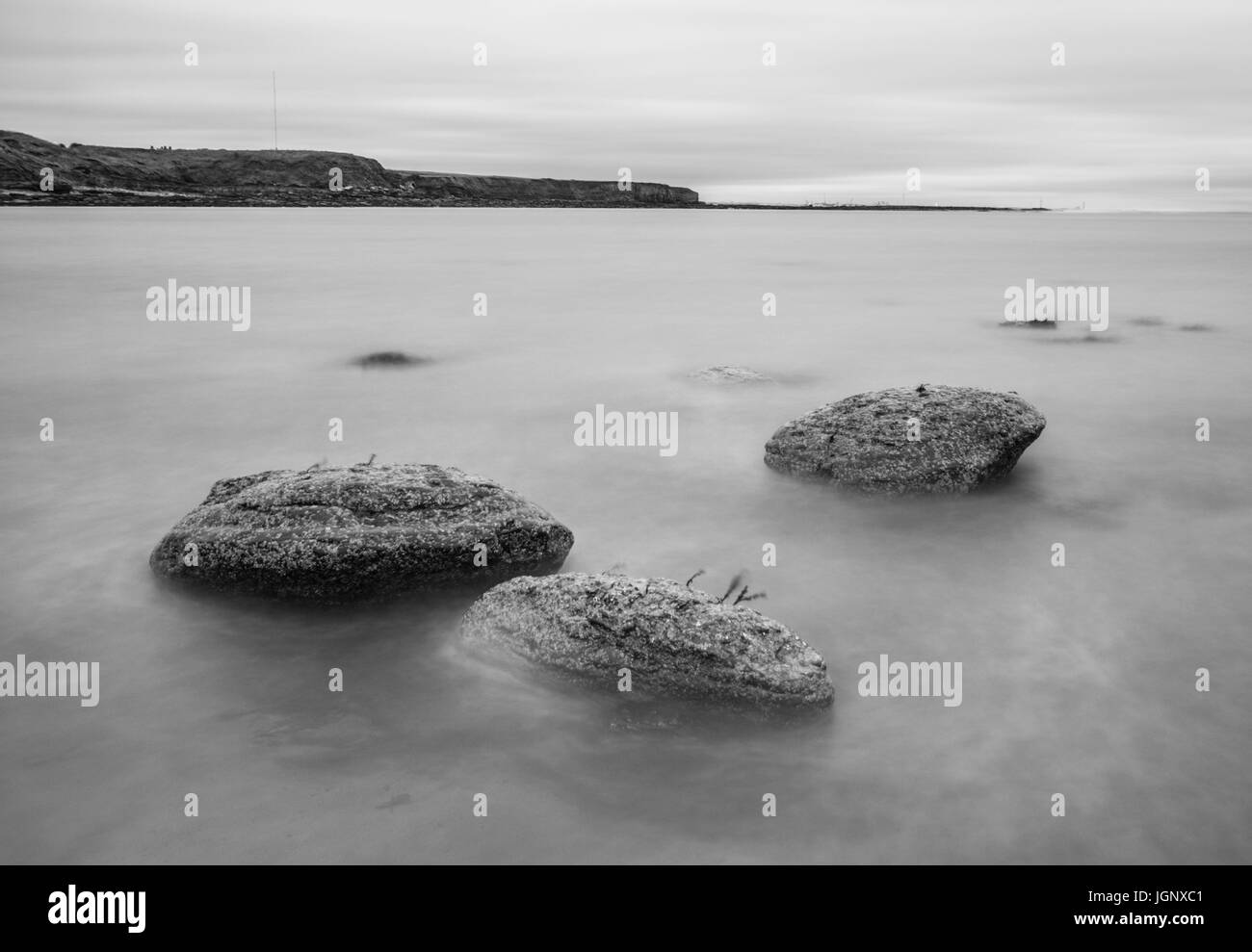 Misty coastal water around rocks Stock Photo - Alamy