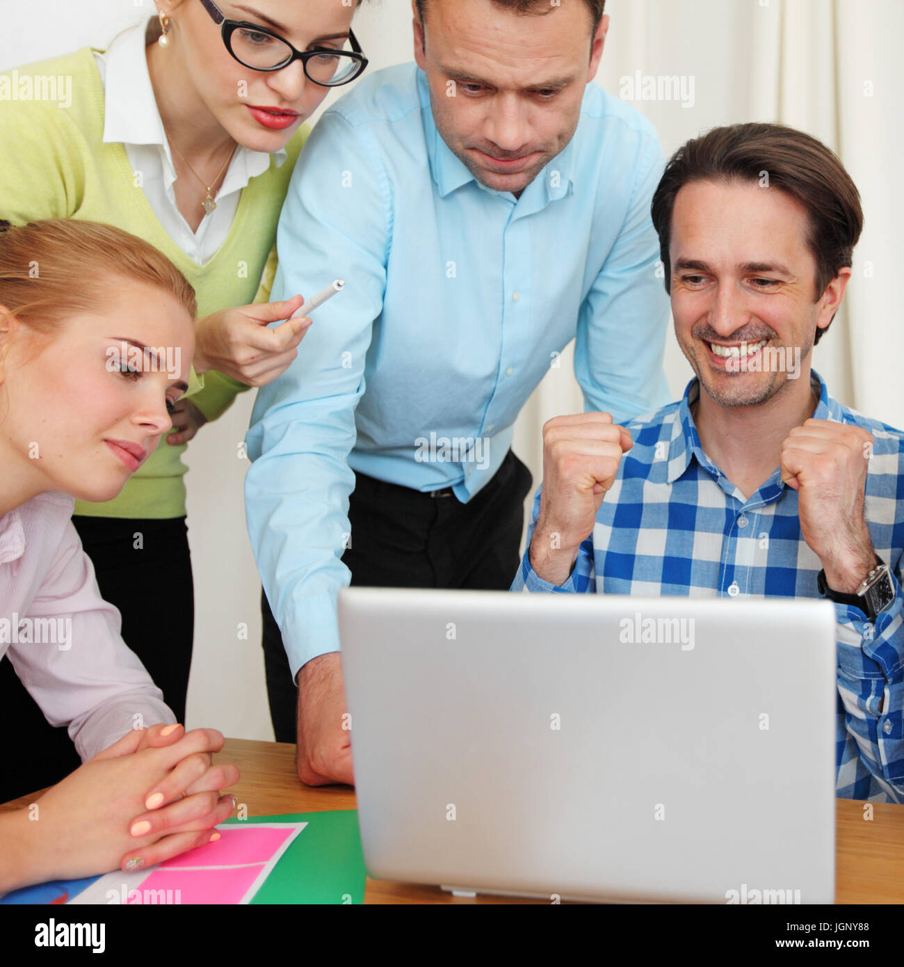 Business team work together looking at one laptop at workplace Stock ...