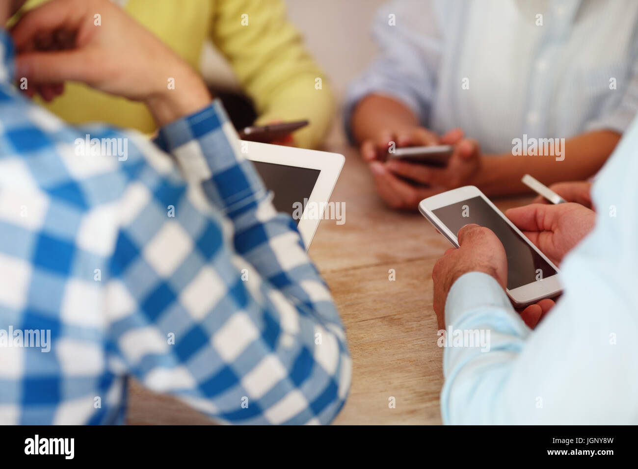 Group of multi generation people use technology together of smartphones ...