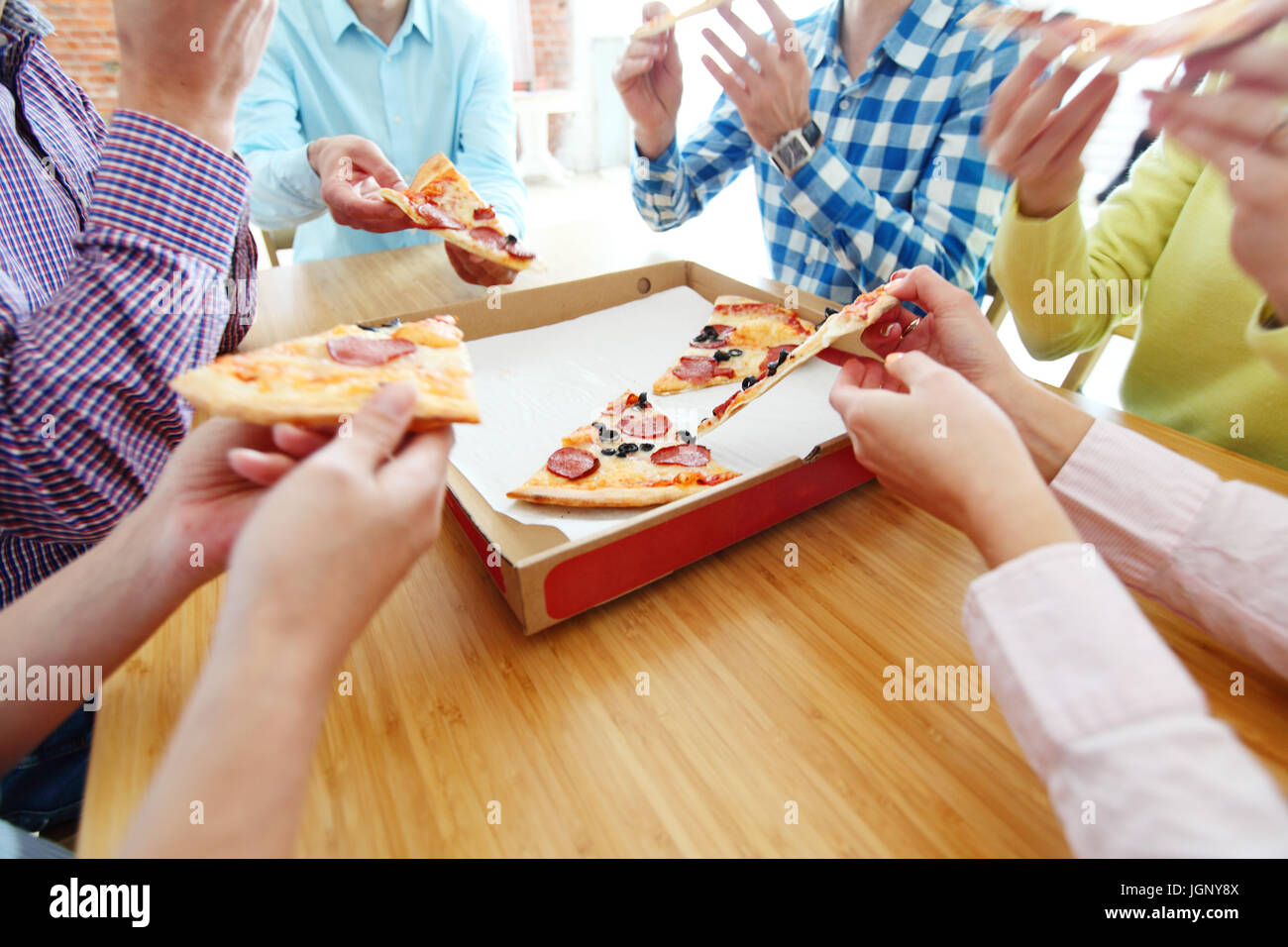 Hands grabbing food hi-res stock photography and images - Alamy