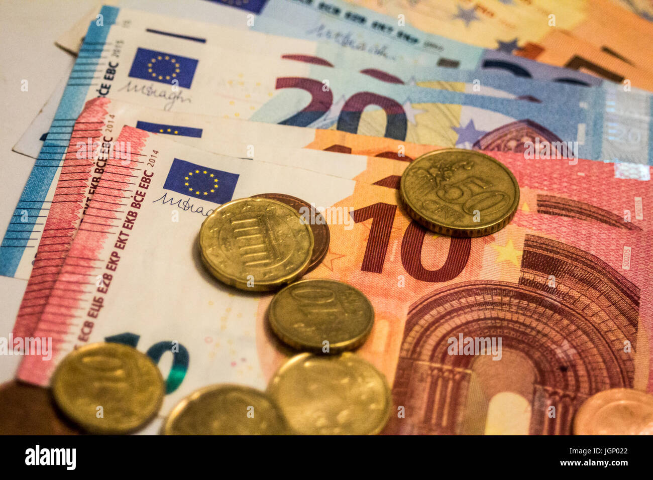 A composition of euro banknotes and coins providing great options to be ...