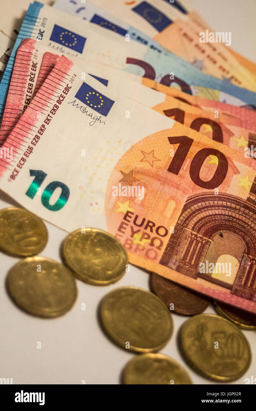 A composition of euro banknotes and coins providing great options to be ...