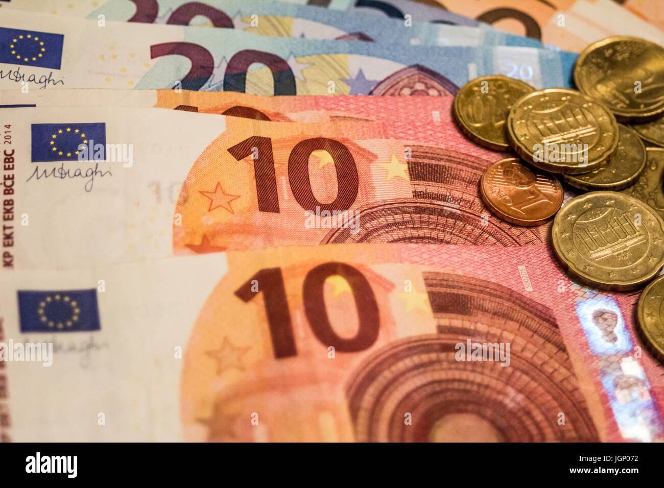 A composition of euro banknotes and coins providing great options to be ...